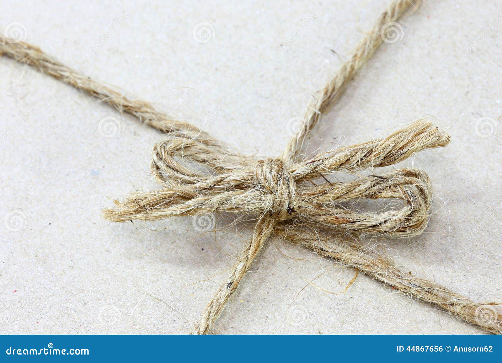 String Tied in a Bow Brown Recycled Paper Stock Photo - Image of brown ...