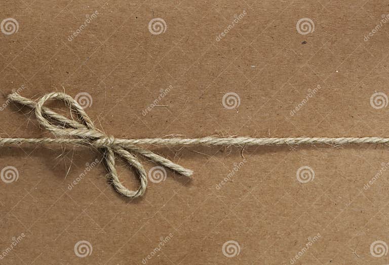 String Tied on Recycled Paper Stock Image - Image of cardboard, string ...