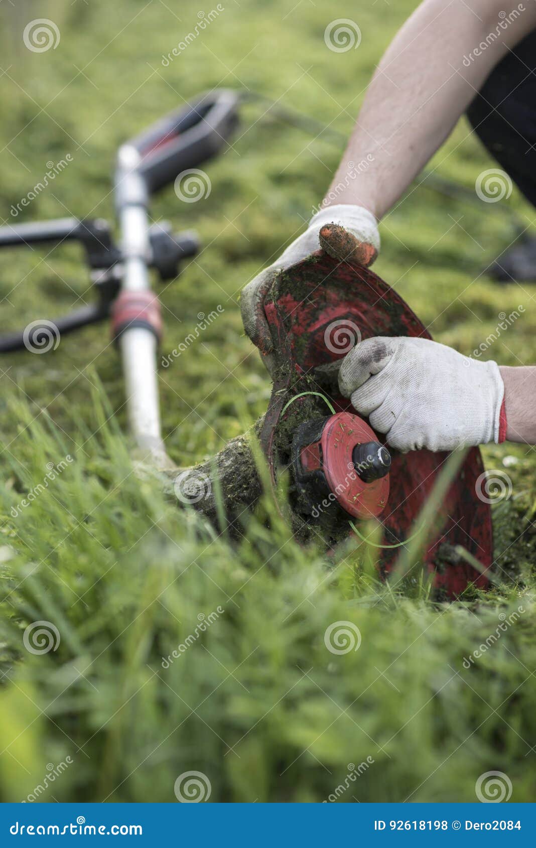 String Trimmer Cleaning after Cutting the Grass, Workflow Stock Photo ...