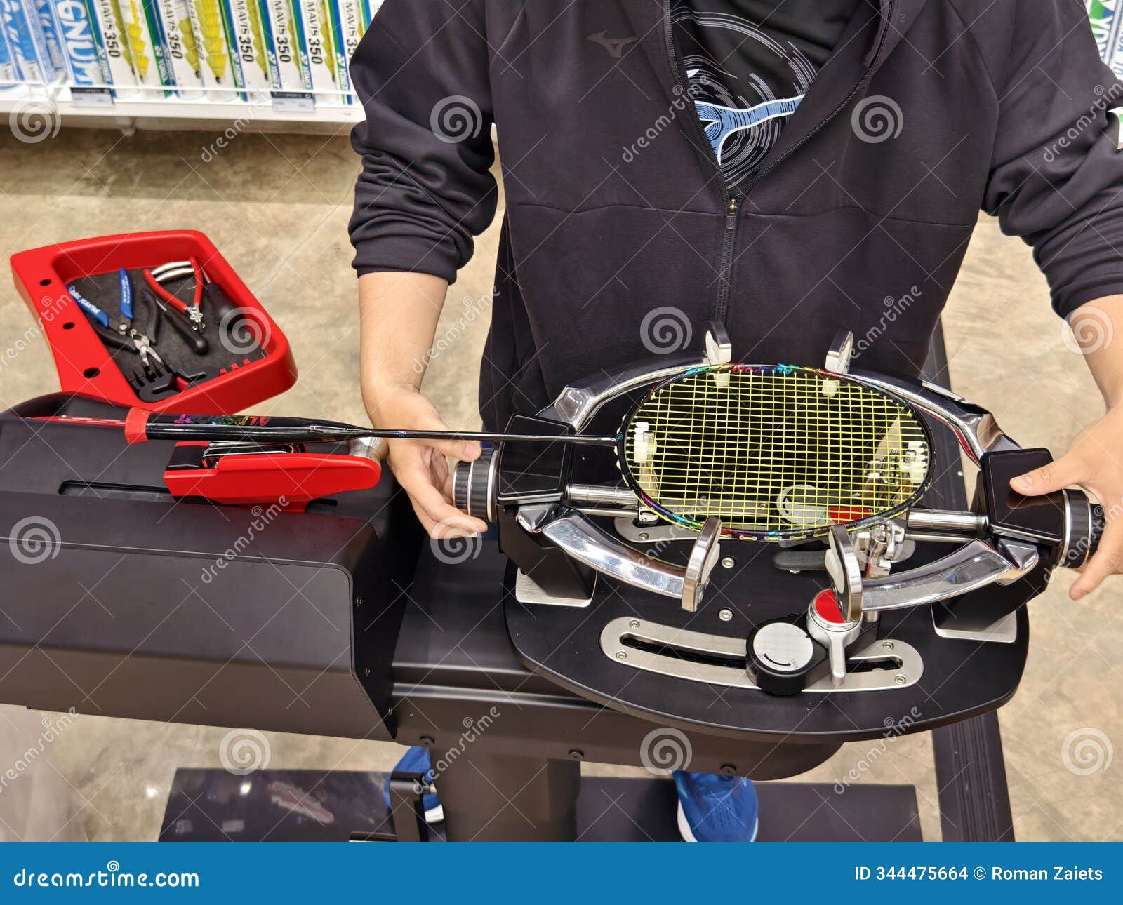 Strings a Badminton Racket on a Racket Stringing Machine. Stock Photo ...