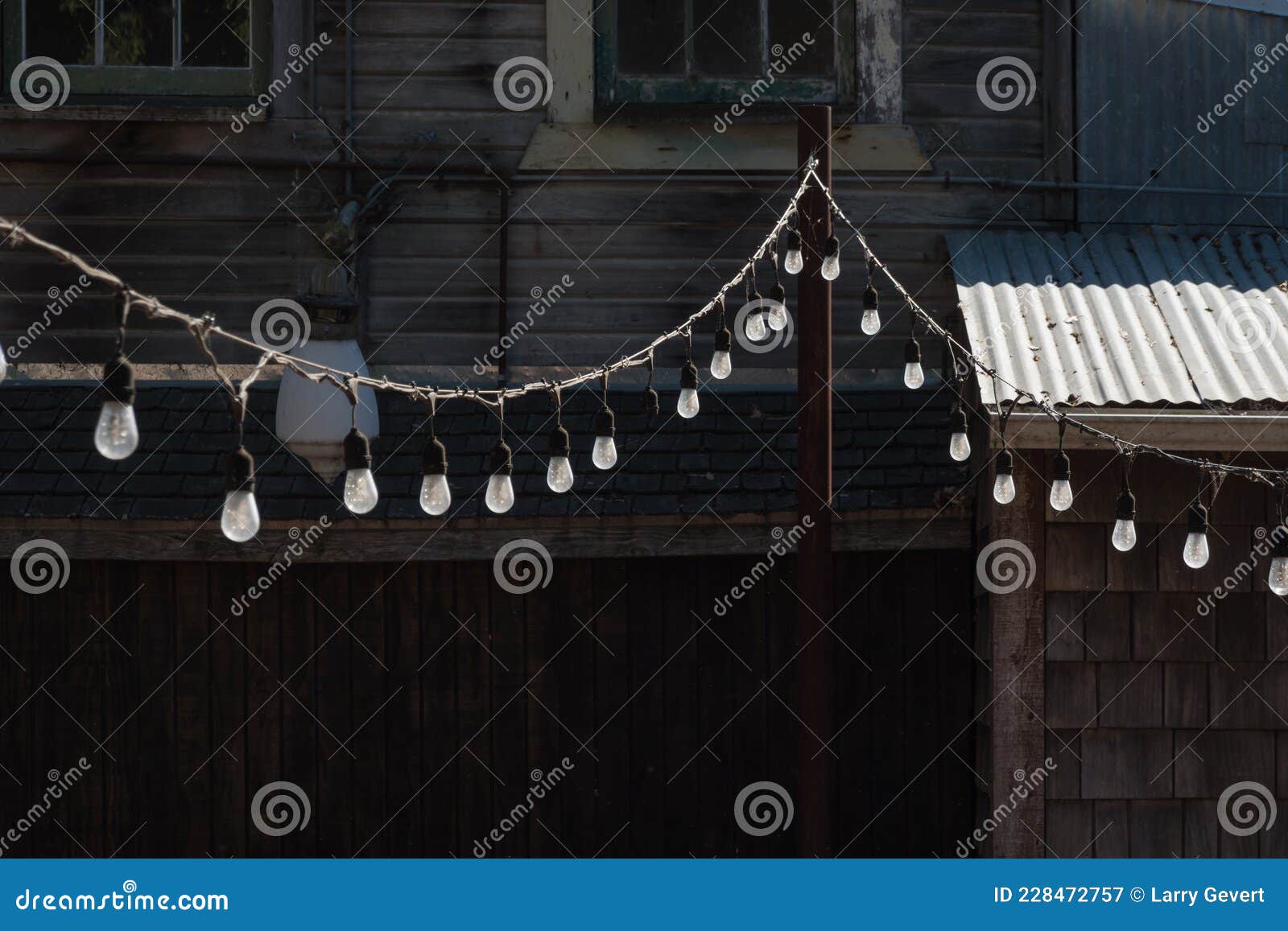 Strings of Lights Behind a Barn Stock Image - Image of deco, landscaped ...