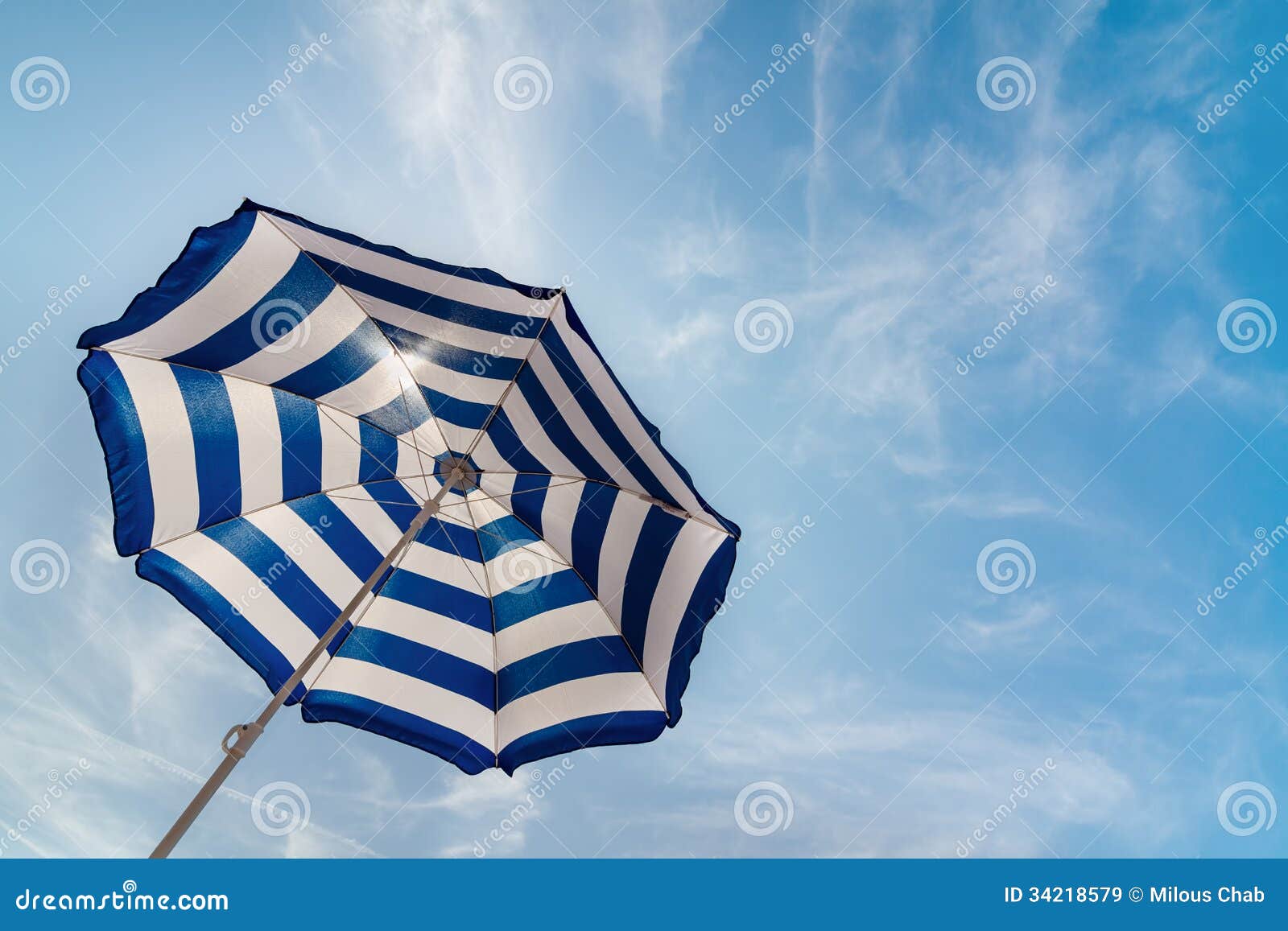 Striped sun umbrella stock image. Image of umbrella, blue - 34218579