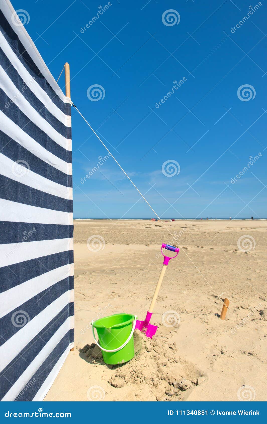 Striped Windbreak at the Beach Stock Image - Image of sunny, shovel ...