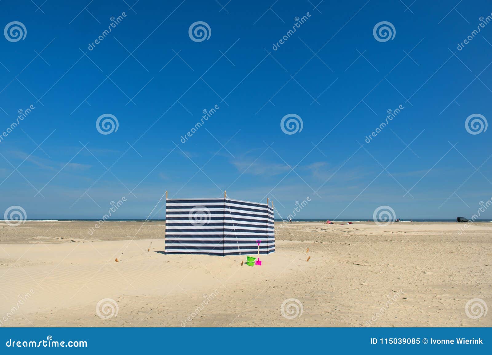 Striped Windbreak at the Beach Stock Image - Image of bucket, water ...