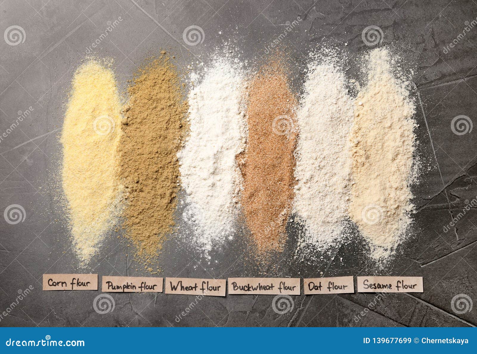 Stripes of Different Flour Types and Tags on Grey Table Stock Image ...