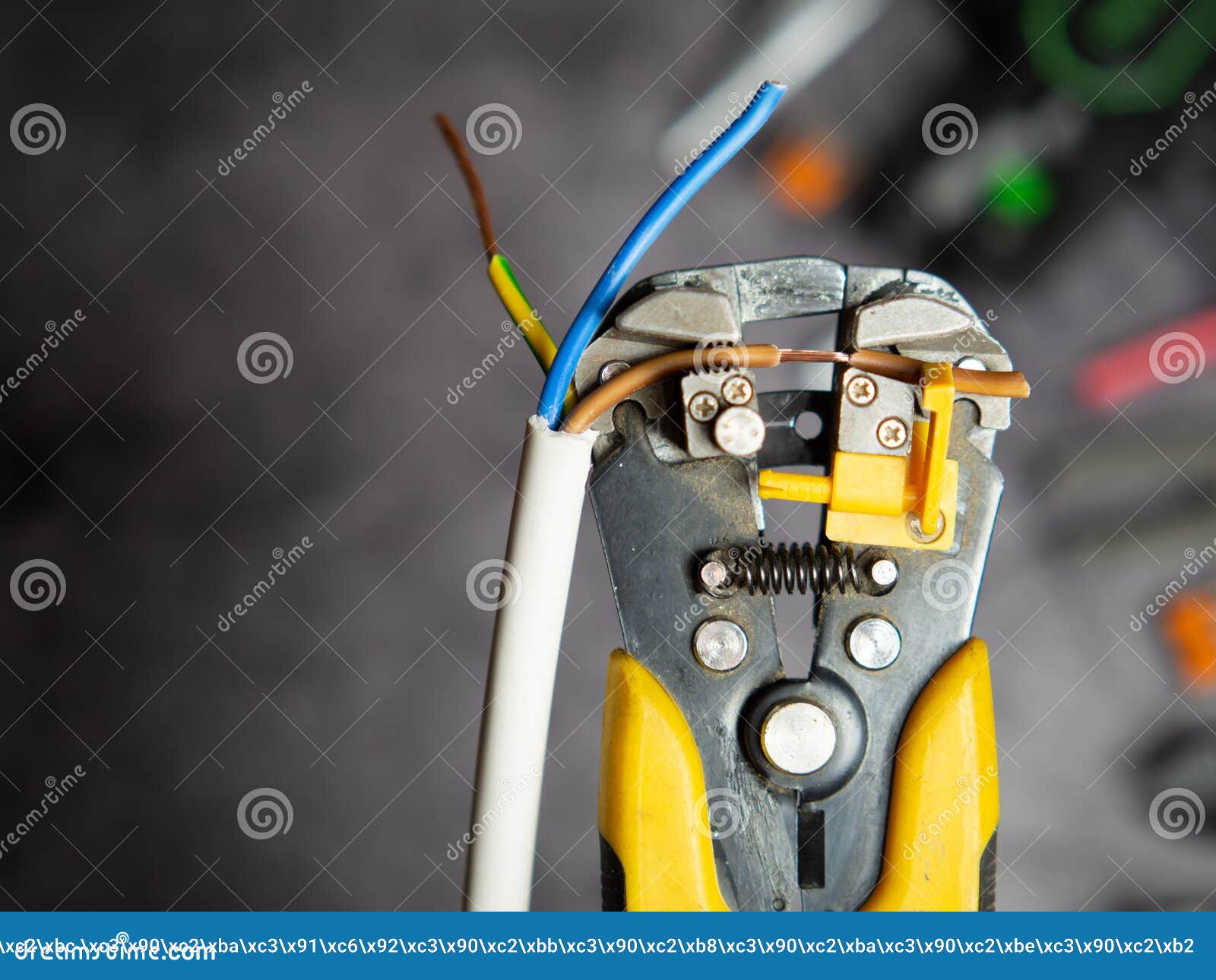 An Electrician Strips Electrical Wires. Yellow Wire Cutters Strip The ...