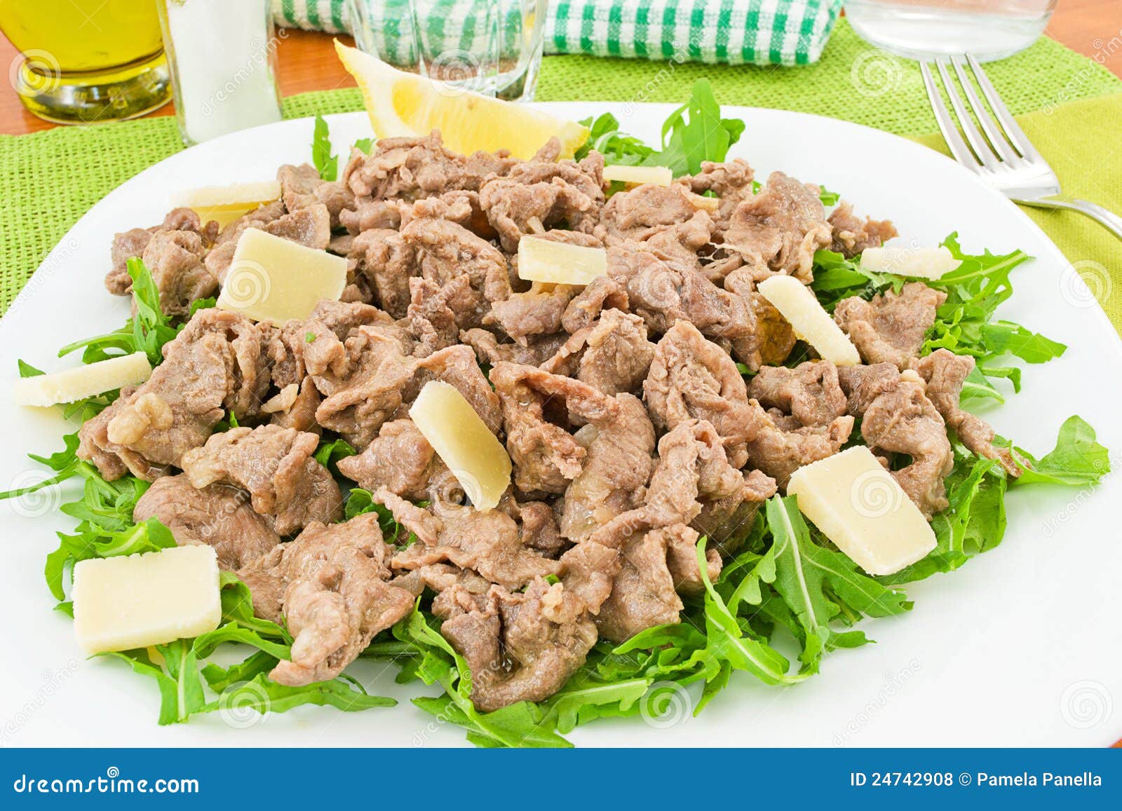 Strips of Beef with Rocket and Parmesan Flakes Stock Photo - Image of ...