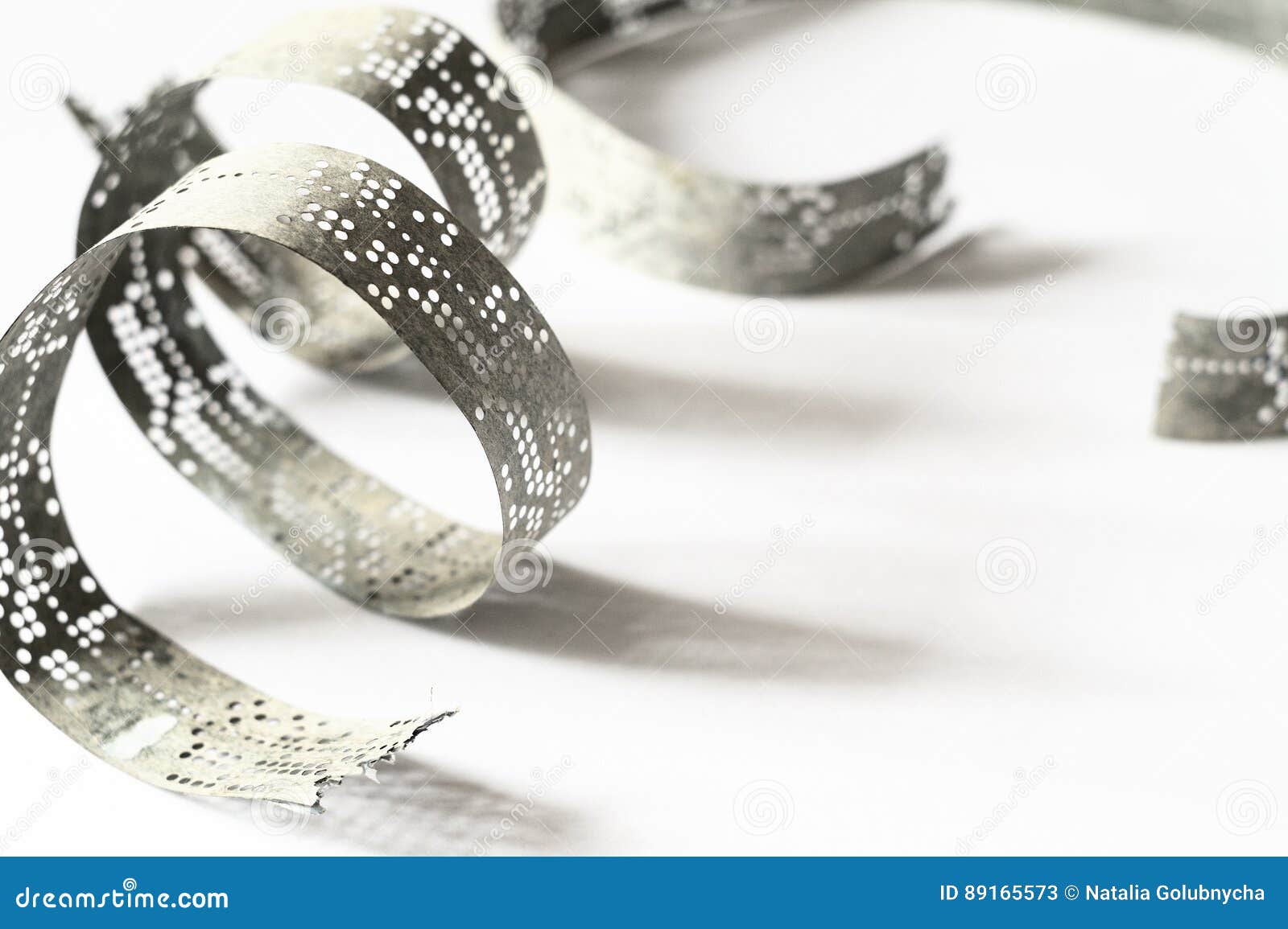 Strips of Old Punched Tape on a White Surface Stock Image - Image of ...