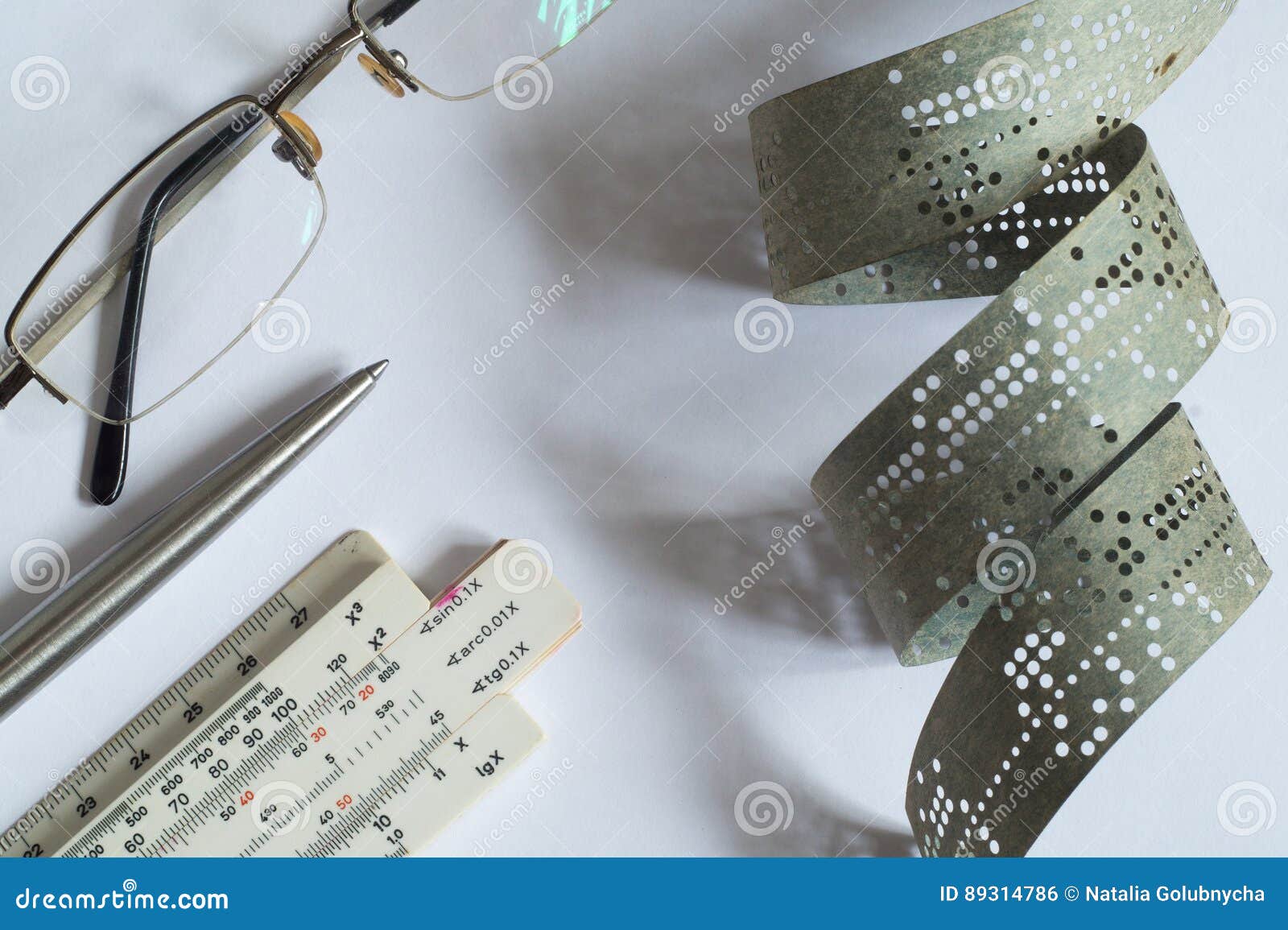 Strips of Old Punched Tape on a White Surface Stock Photo - Image of ...