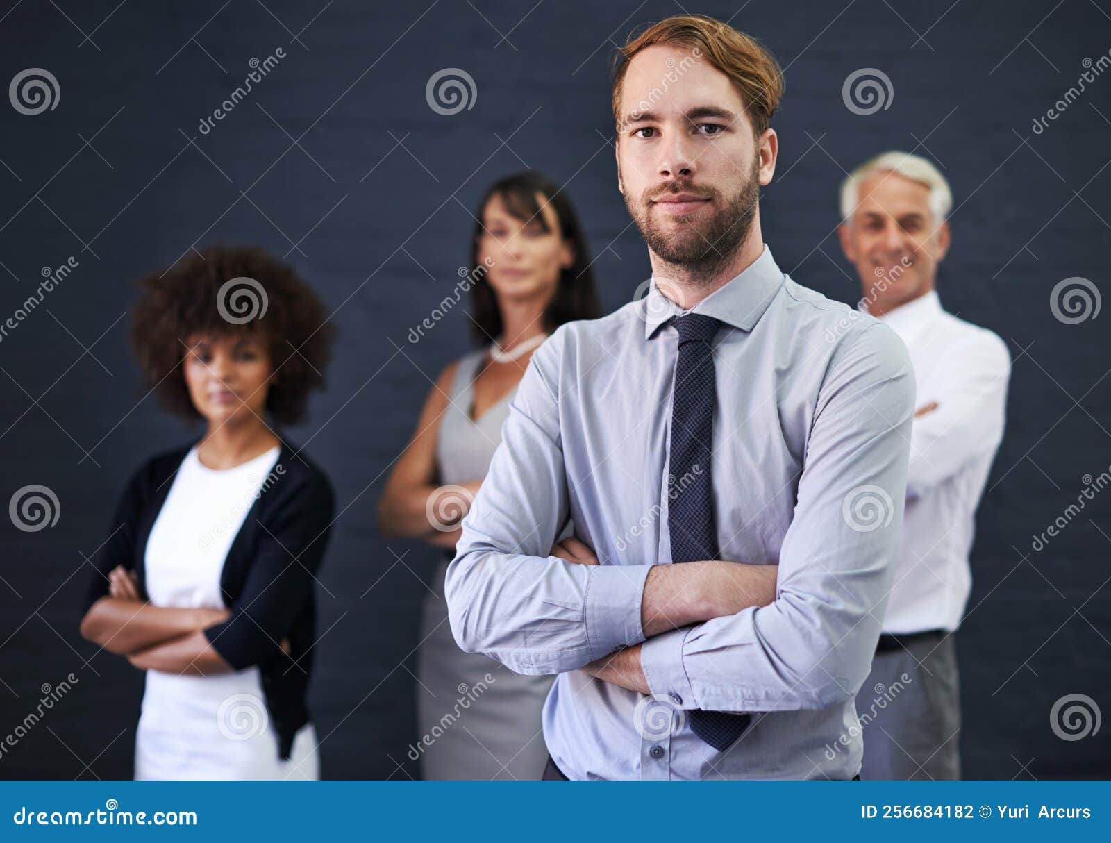 We Strive for Excellence. a Young Professional Man Standing in Front of ...