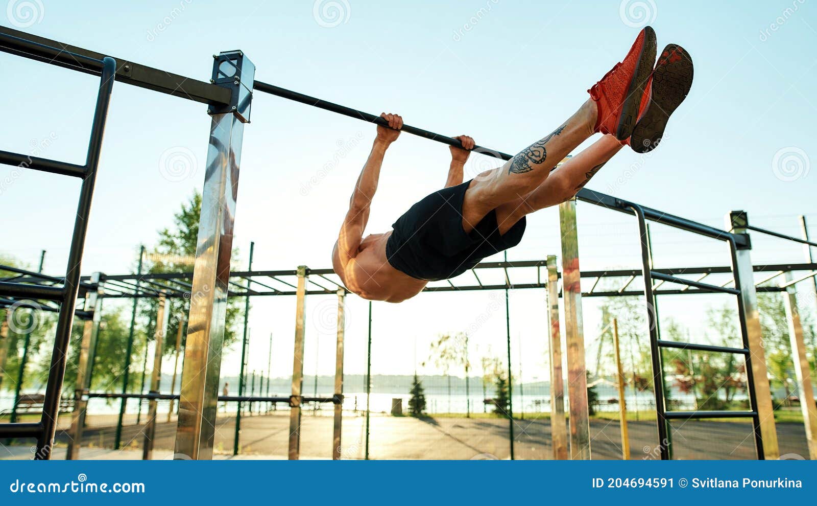 Strong Athlete Doing Statics Exercise on Horizontal Bar Stock Image ...