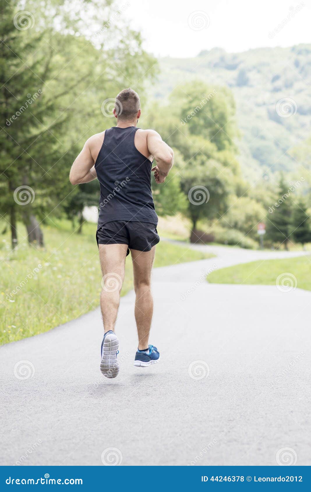 Strong Athletic Man Running Down the Road, Concept of Healthy Li Stock ...