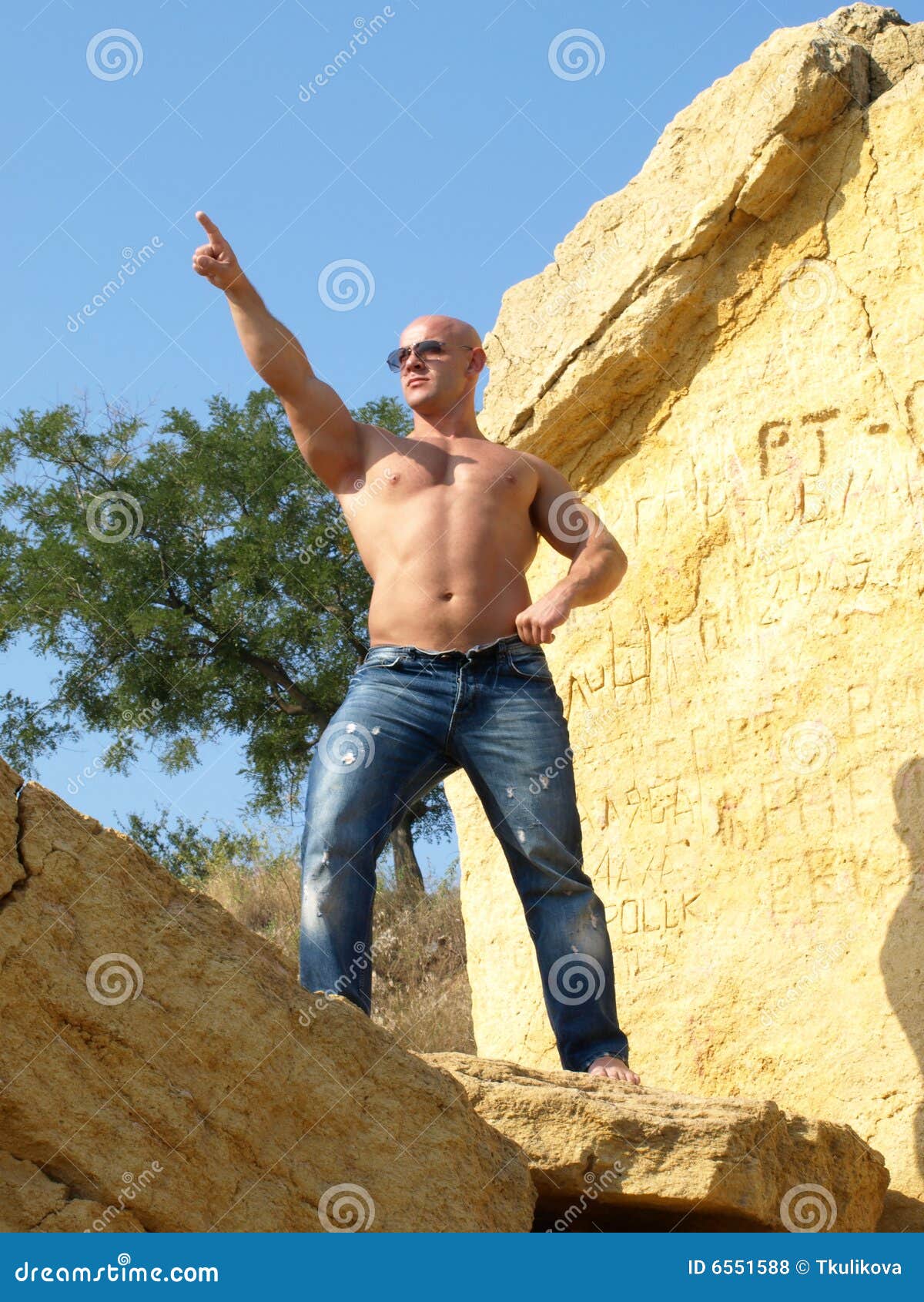 Strong Bald Man Pointing Up Stock Photo - Image of attractive, muscle ...