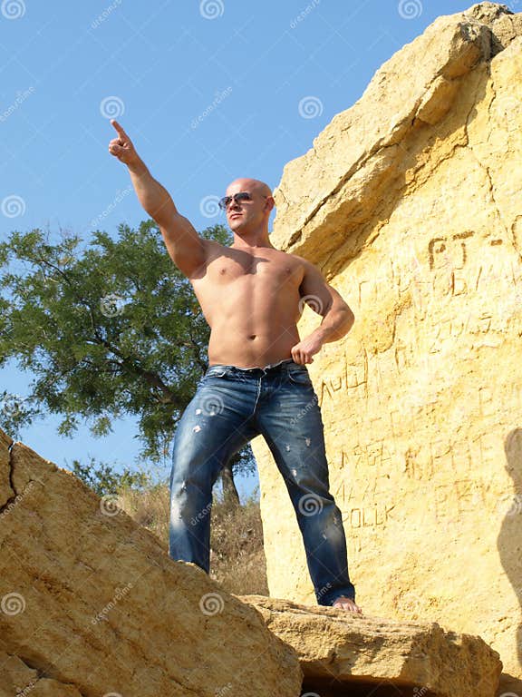 Strong Bald Man Pointing Up Stock Photo - Image of attractive, muscle ...