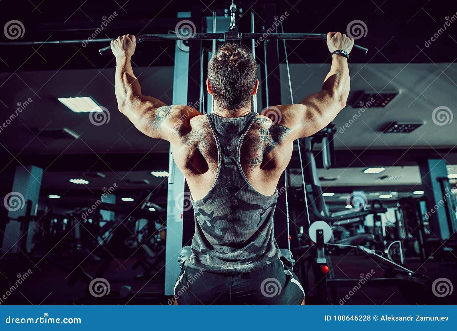 Strong Bodybuilder Doing Heavy Weight Exercise for Back on Machine ...