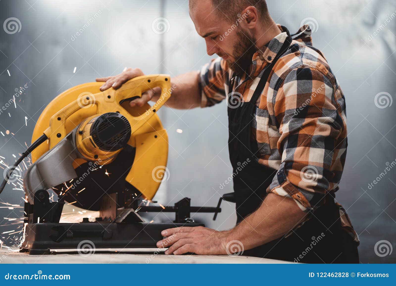 Strong Bearded Mechanic Working On Electrical Angular Grinding Machine ...