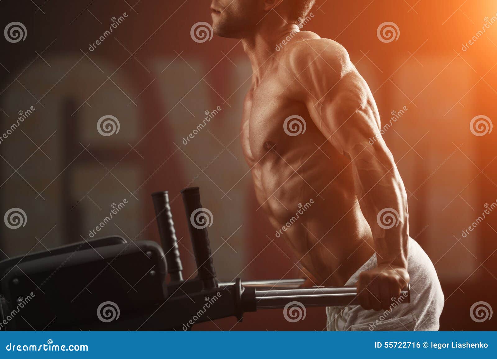 Strong Bodybuilder Doing Exercise on Bars Stock Photo - Image of ...