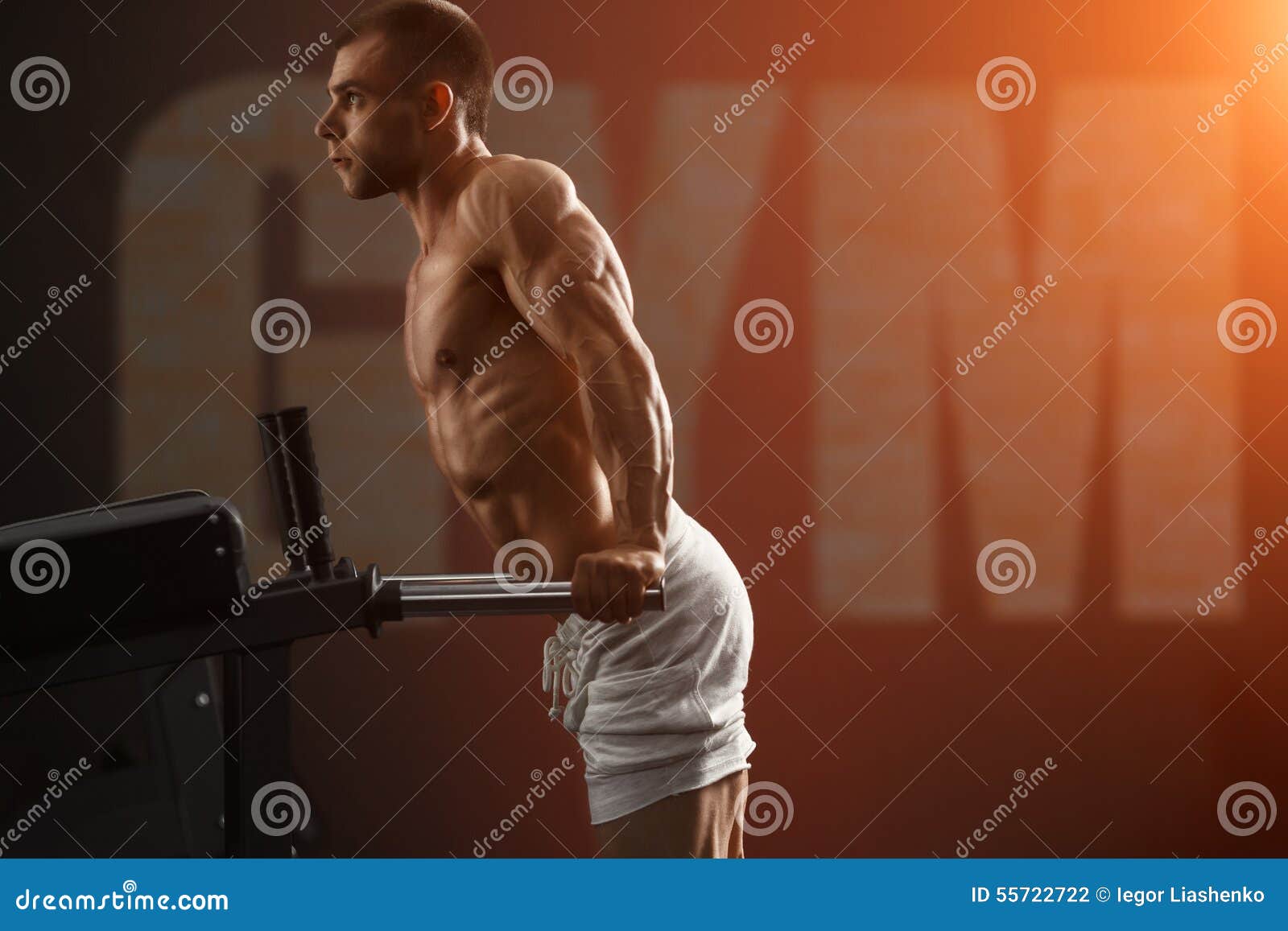 Strong Bodybuilder Doing Exercise on Bars Stock Photo - Image of ...