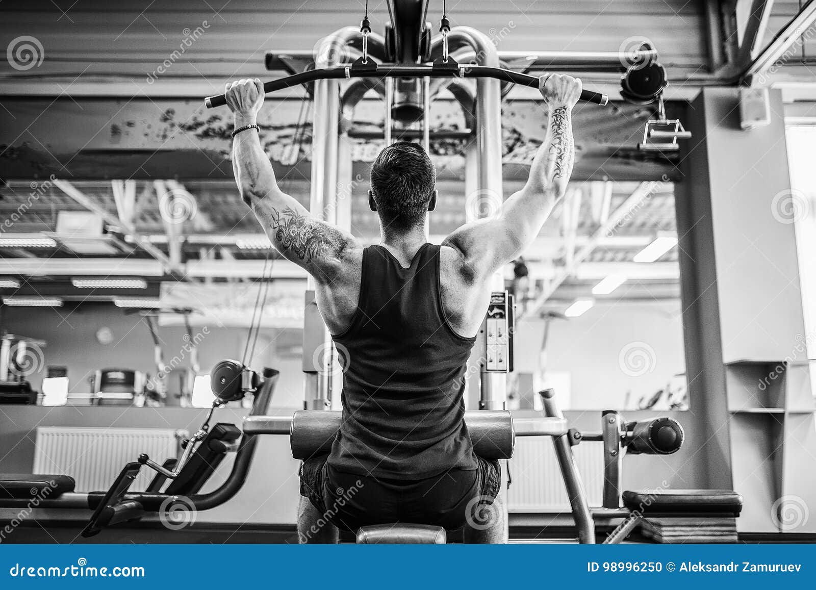 Strong Bodybuilder Doing Heavy Weight Exercise for Back on Machine ...