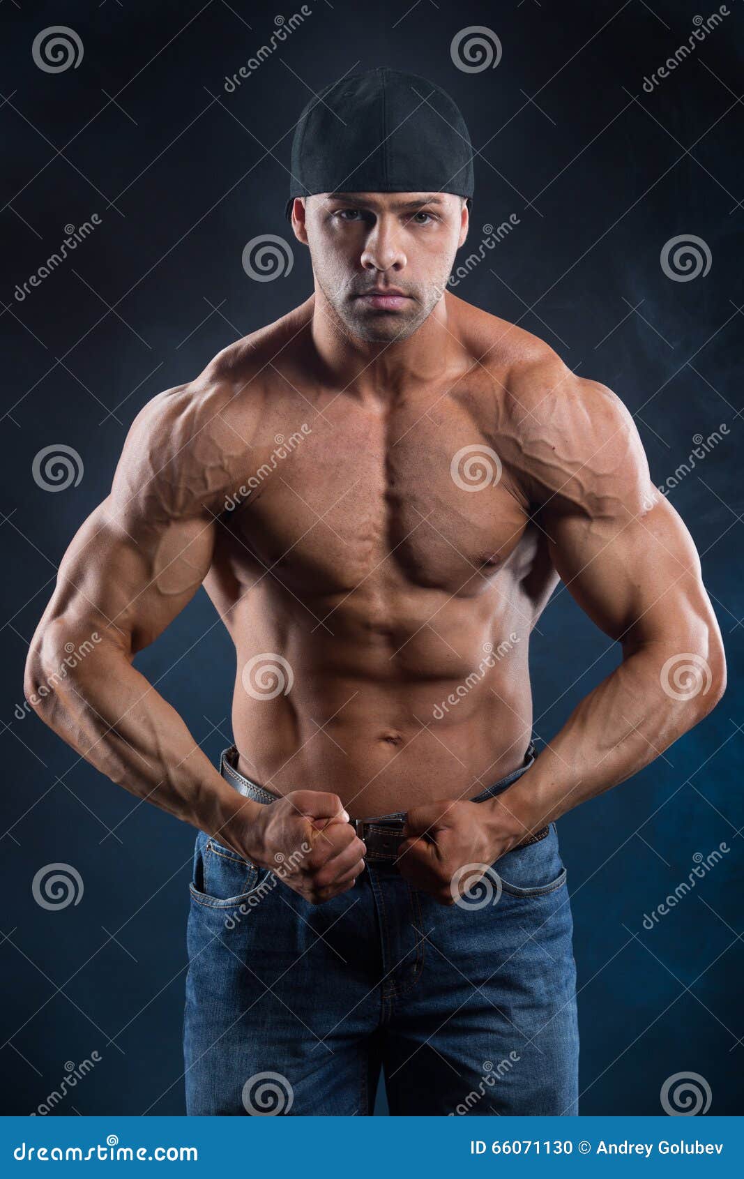 Strong Bodybuilder Strains His Powerful Muscles Stock Photo - Image of ...