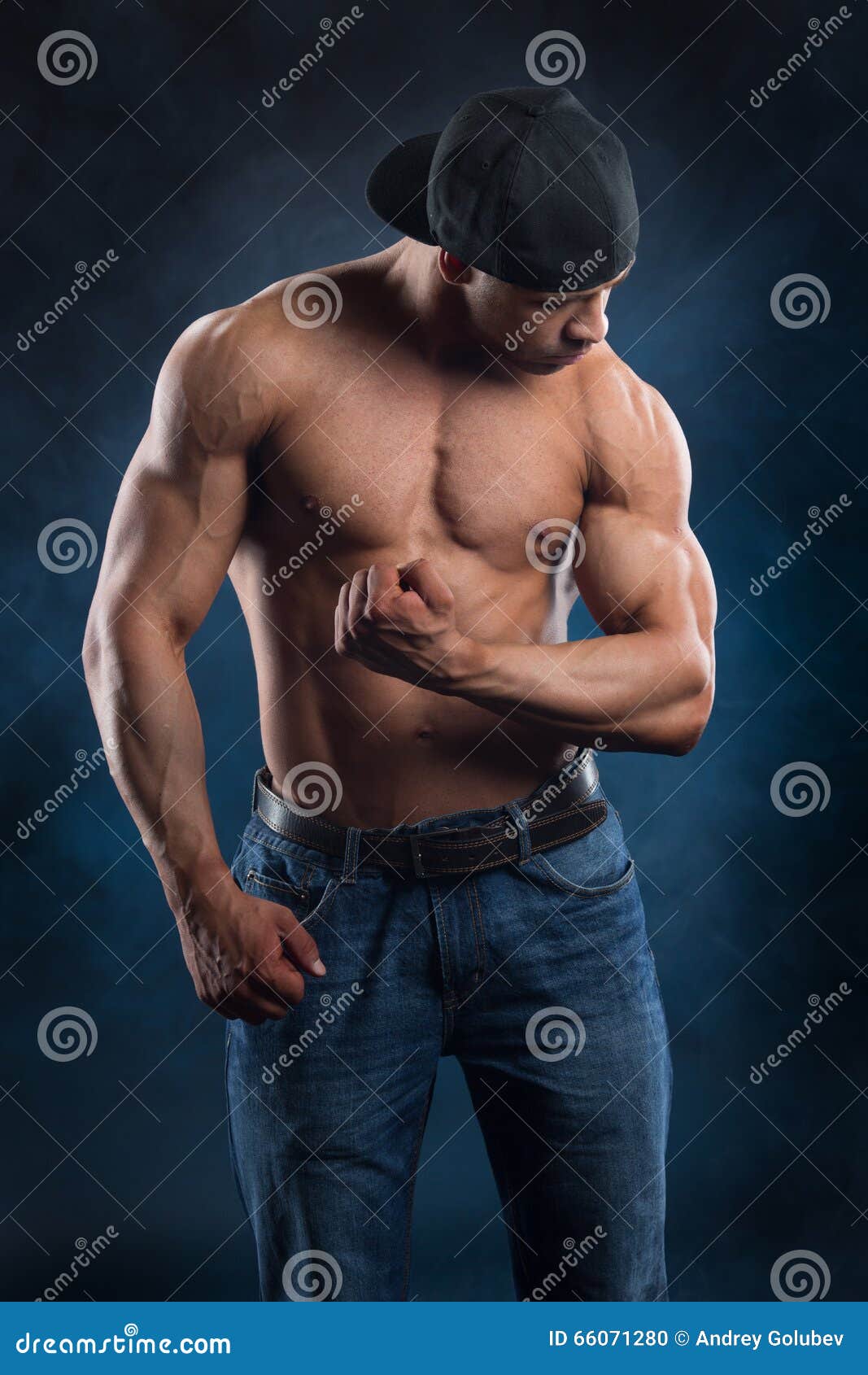 Strong Bodybuilder Strains His Powerful Muscles Stock Photo - Image of ...