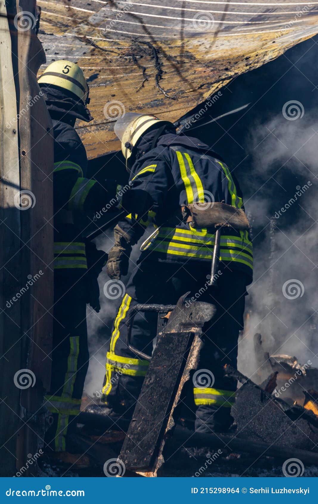A Strong and Brave Fireman Rescues a Burning Building Using Water in a ...