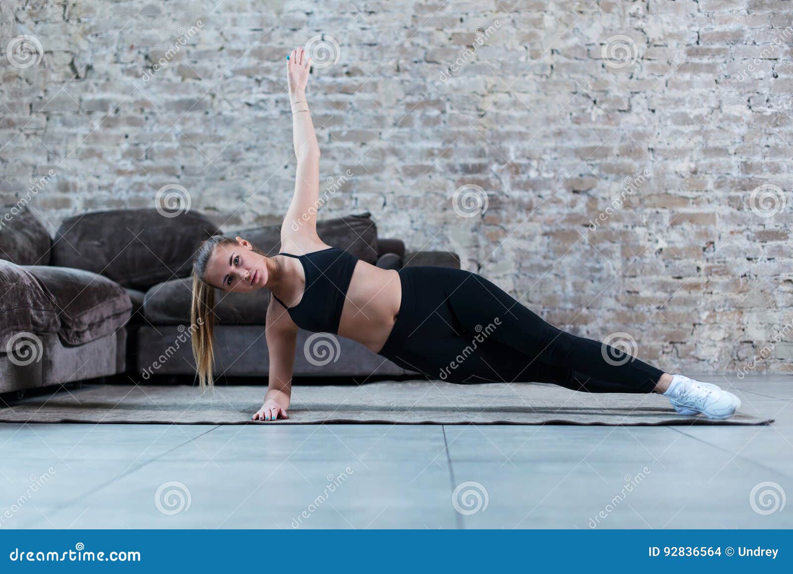 Strong Caucasian Girl Doing Side Plank Exercise Practicing Pilates at ...