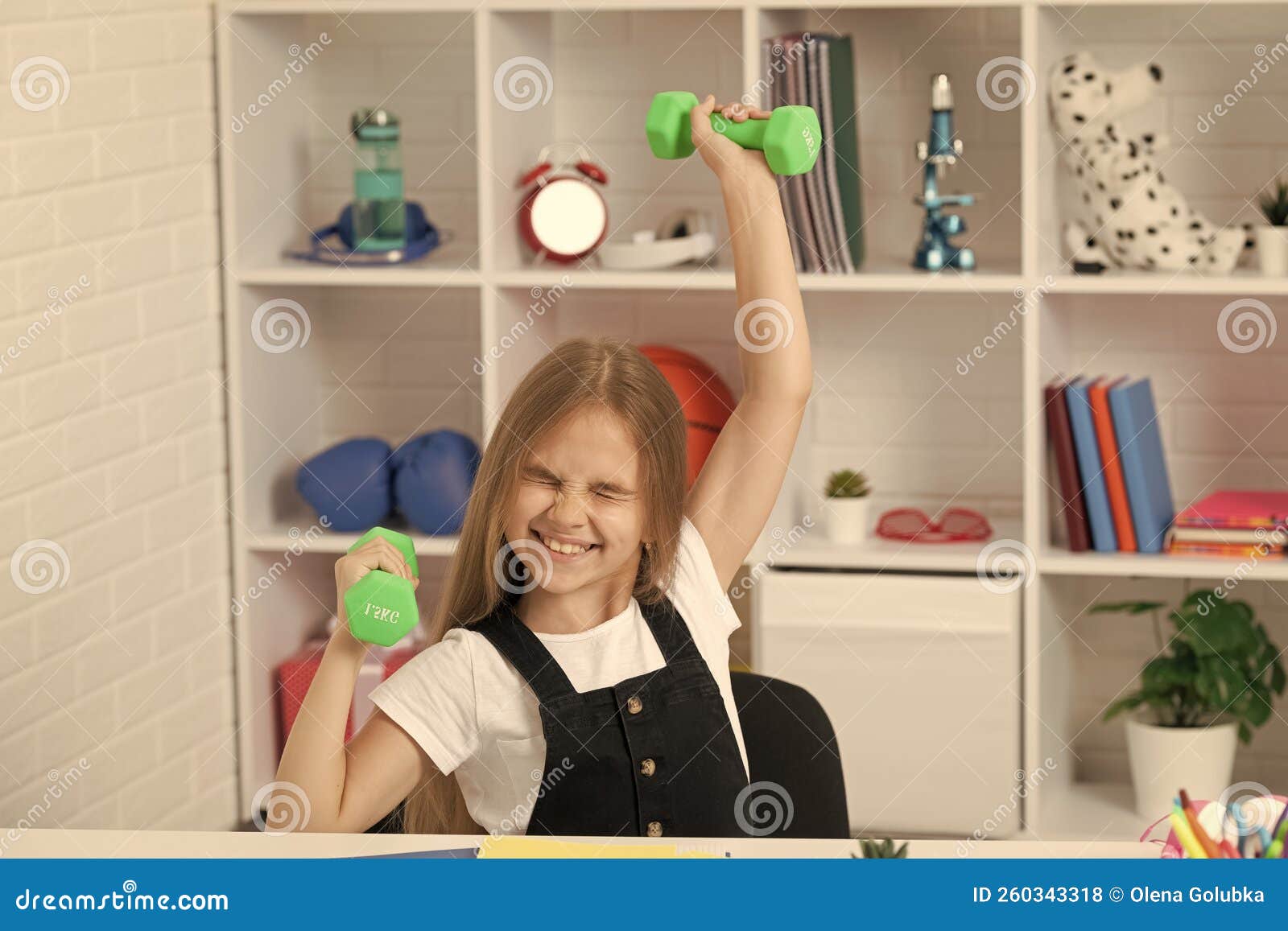 Strong Child Hold Barbells in School Classroom Stock Photo - Image of ...