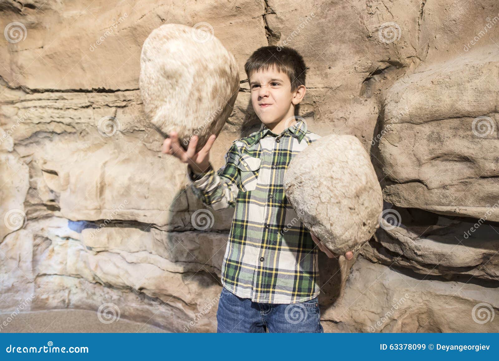 Strong Child Holds Heavy Stone Stock Image - Image of heavy, expression ...