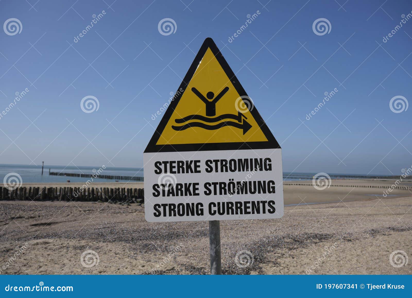 Strong Current Sign on Beach with Blue Sea in the Background Stock ...