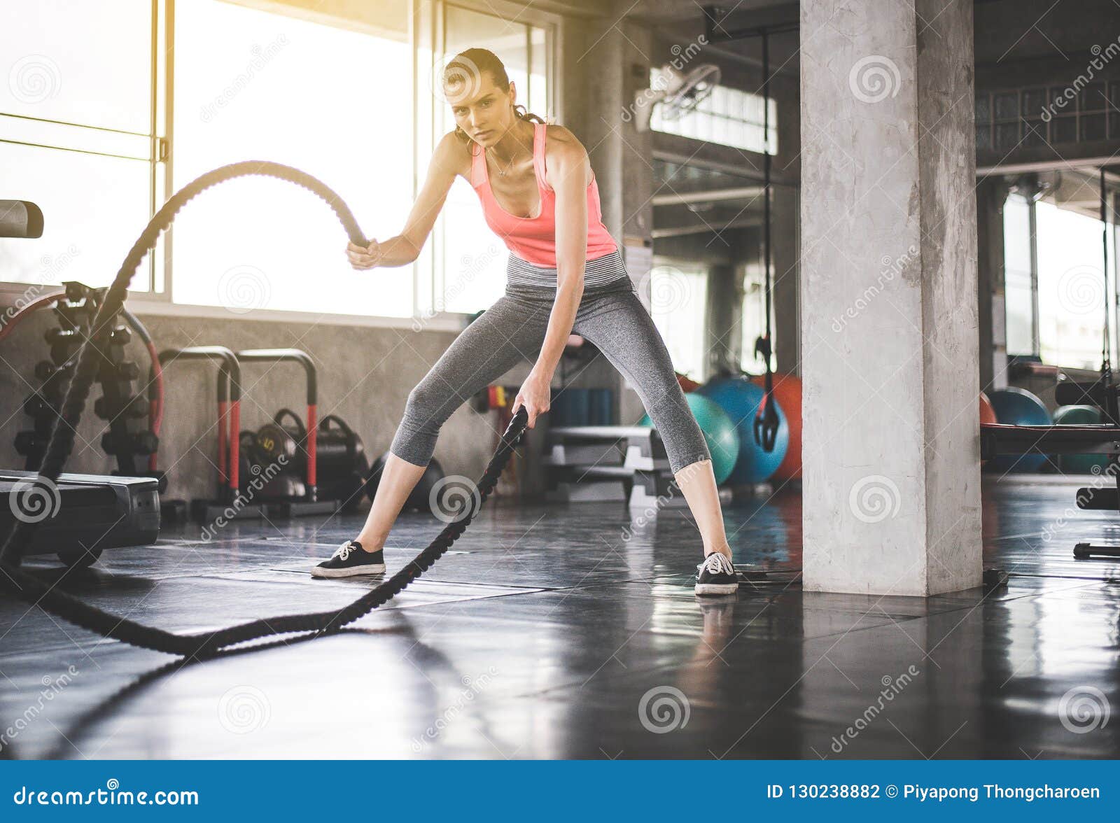 Strong Woman Using Battle Rope at Gym,Female Doing Exercise in ...