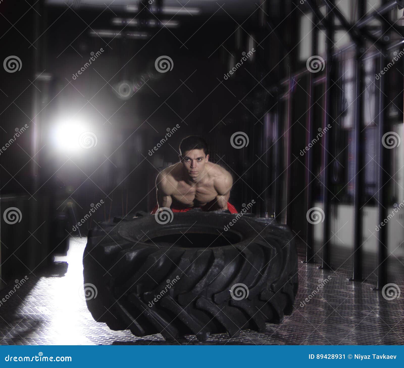Strong and Fit Man Pushing Tire Stock Image - Image of bodybuilding ...