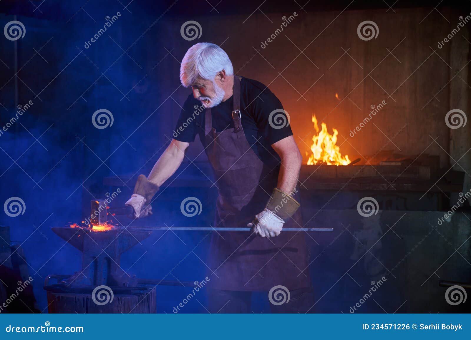 Strong Grey Haired Man Processing Molten Metal on Anvil Stock Photo ...