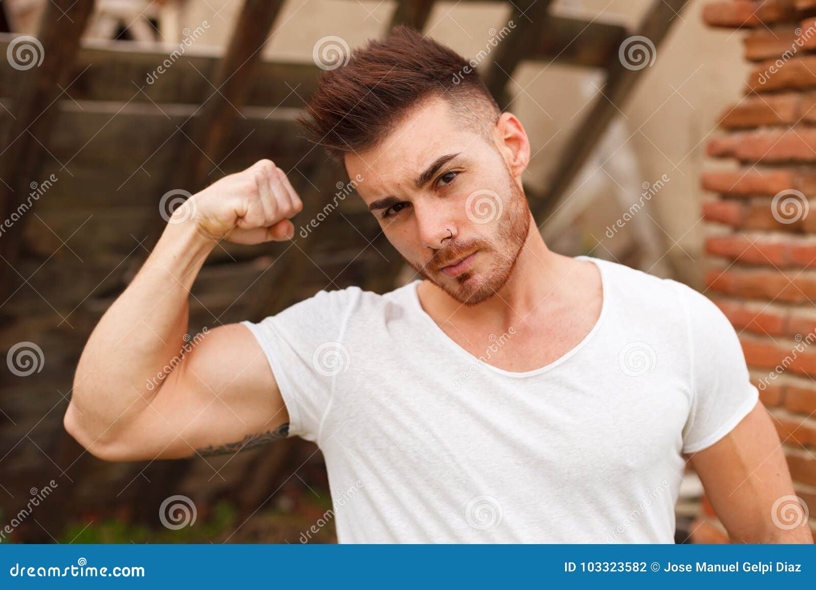 Strong guy in al old house stock photo. Image of fashion - 103323582