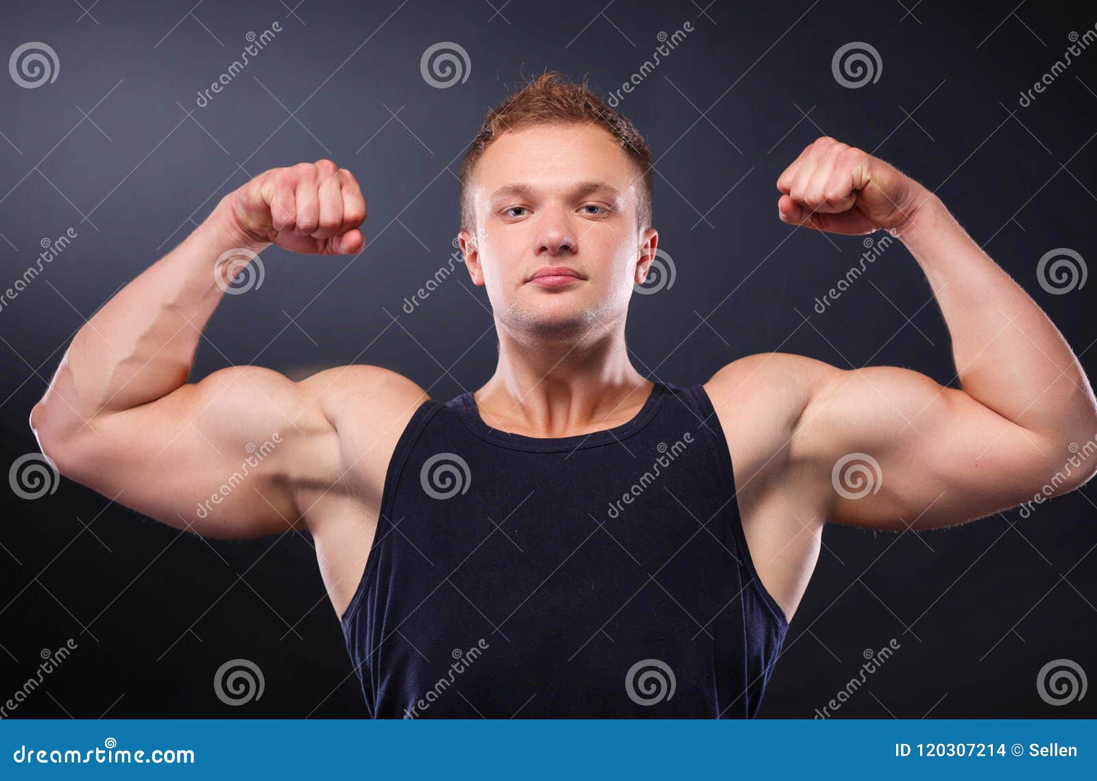 Strong and Handsome Young Bodybuilder Demonstrate His Muscles and ...