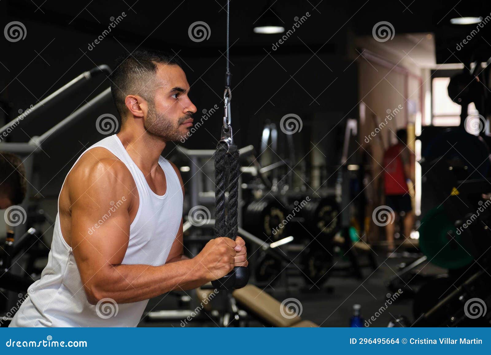 Strong Latin Man Doing Cable Rope Pullovers at a Gym. Stock Photo ...
