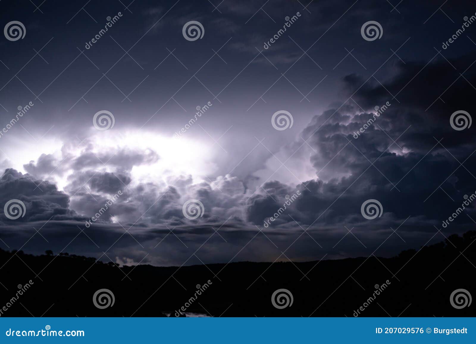 Strong Lightning in and Behind Big Towering Thunderclouds Stock Photo ...