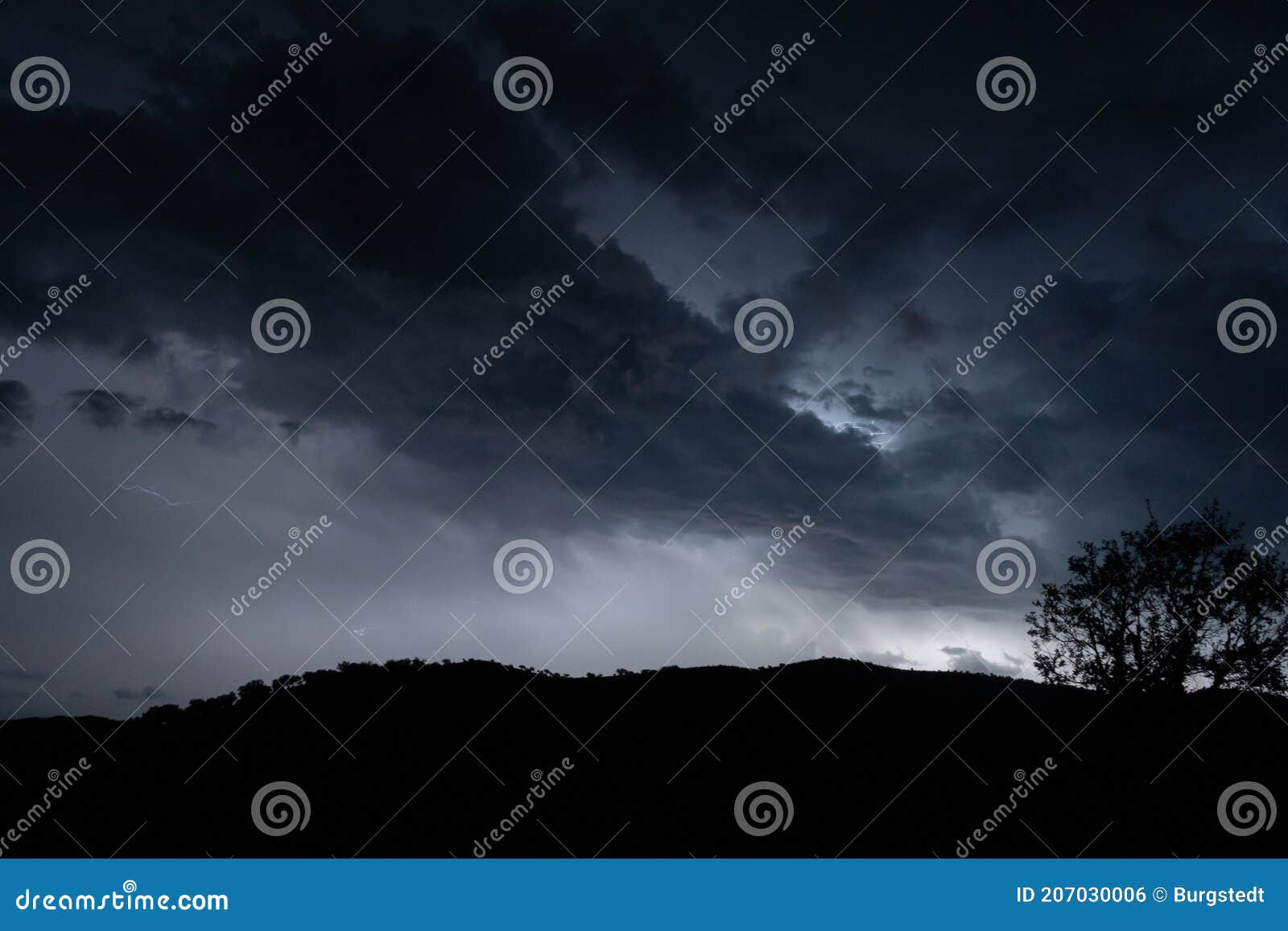 Strong Lightning in and Behind Big Towering Thunderclouds Stock Photo ...