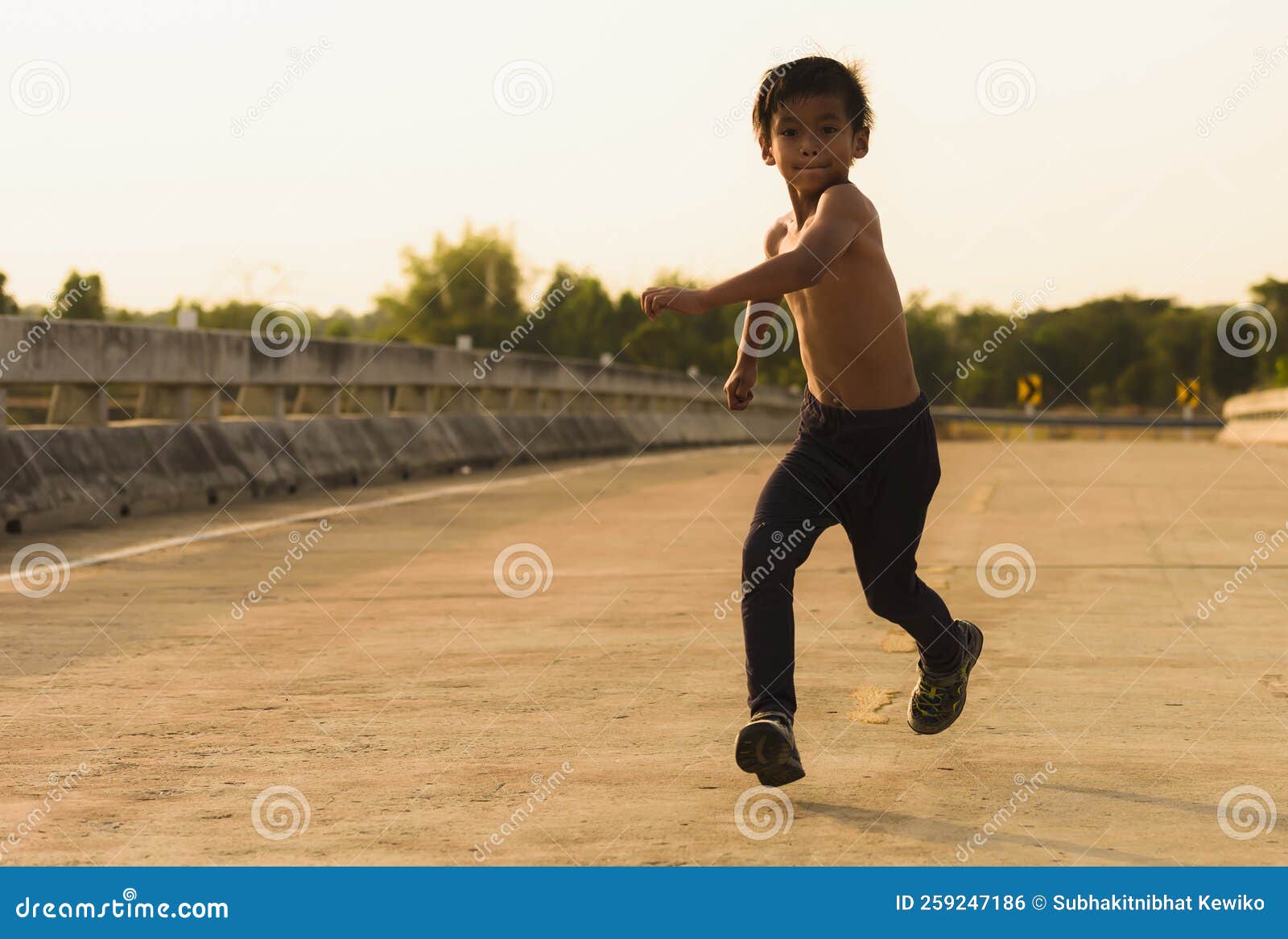 A Strong Little Boy Ran Along the Bridge Stock Photo - Image of copy ...