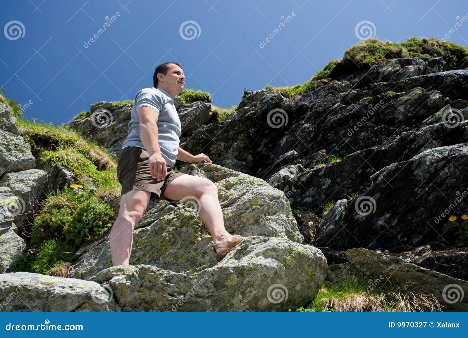 Strong Man Climbing Mountain Stock Image - Image of hill, force: 9970327