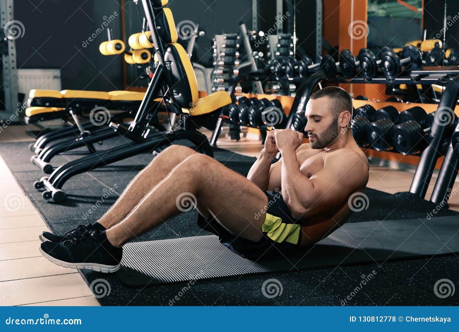 Strong Man Doing Crunches on Mat Stock Photo - Image of fitness, floor ...
