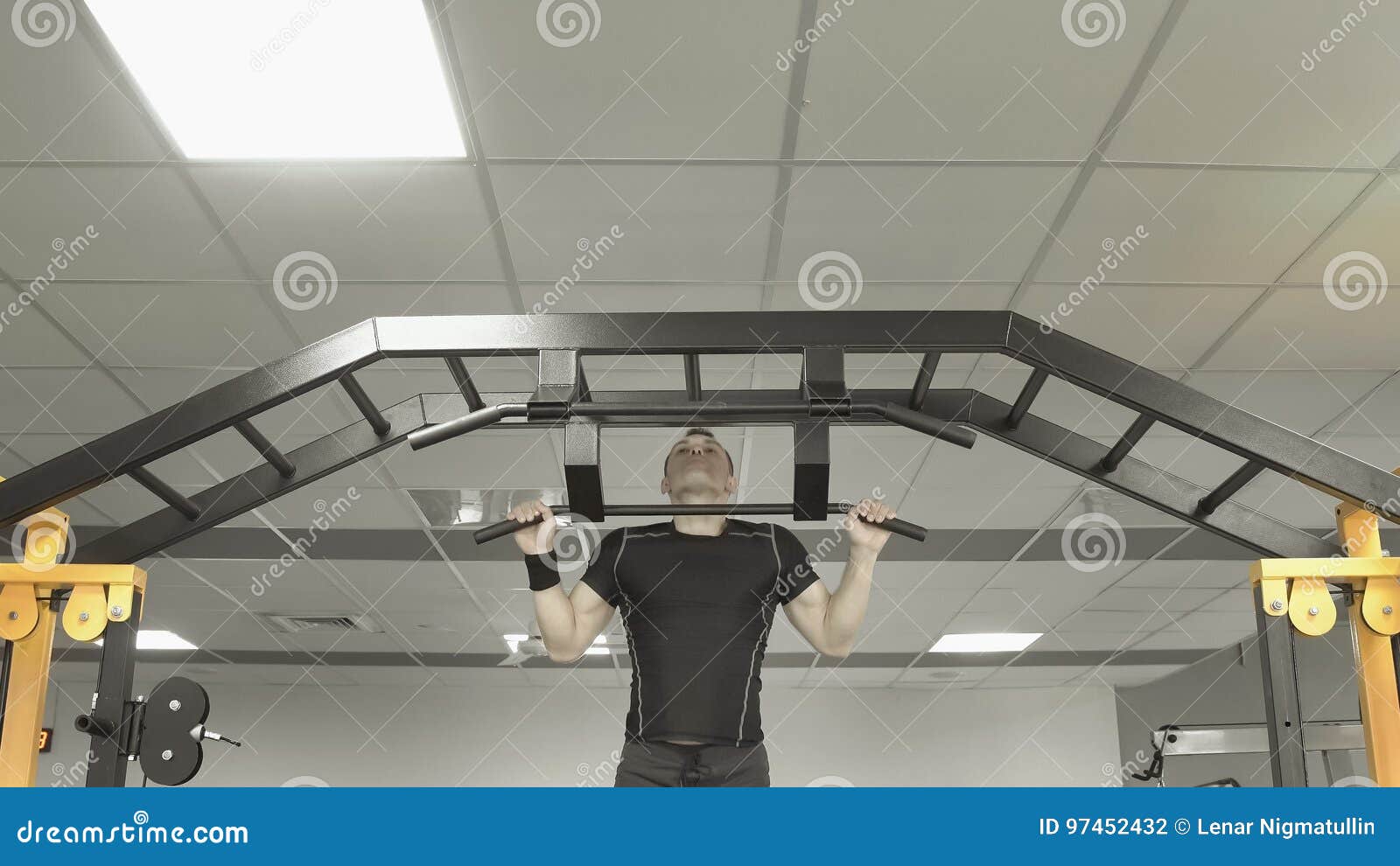 Strong Man Doing Pull Ups in a Gym Stock Photo - Image of powerful ...