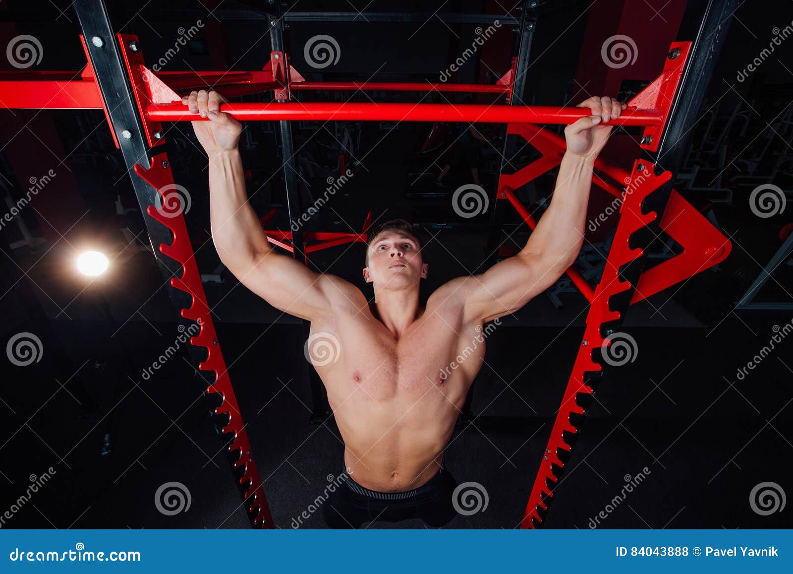 Strong Man Doing Pull Ups Handsome Athlete at Gym. Big Confident ...