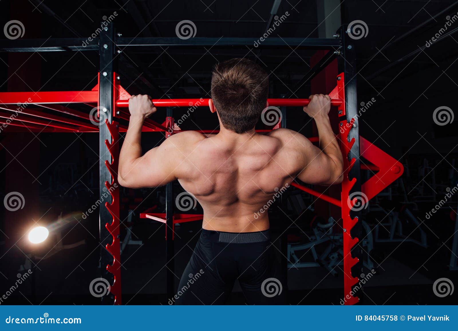 Strong Man Doing Pull Ups Handsome Athlete at Gym. Big Confident ...