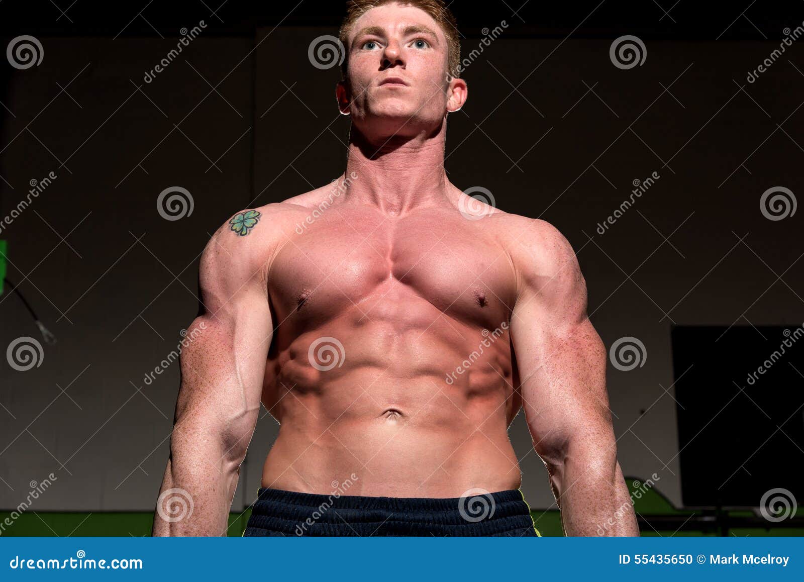 Strong Man Exercising in Dramatic Light Stock Photo - Image of dramatic ...