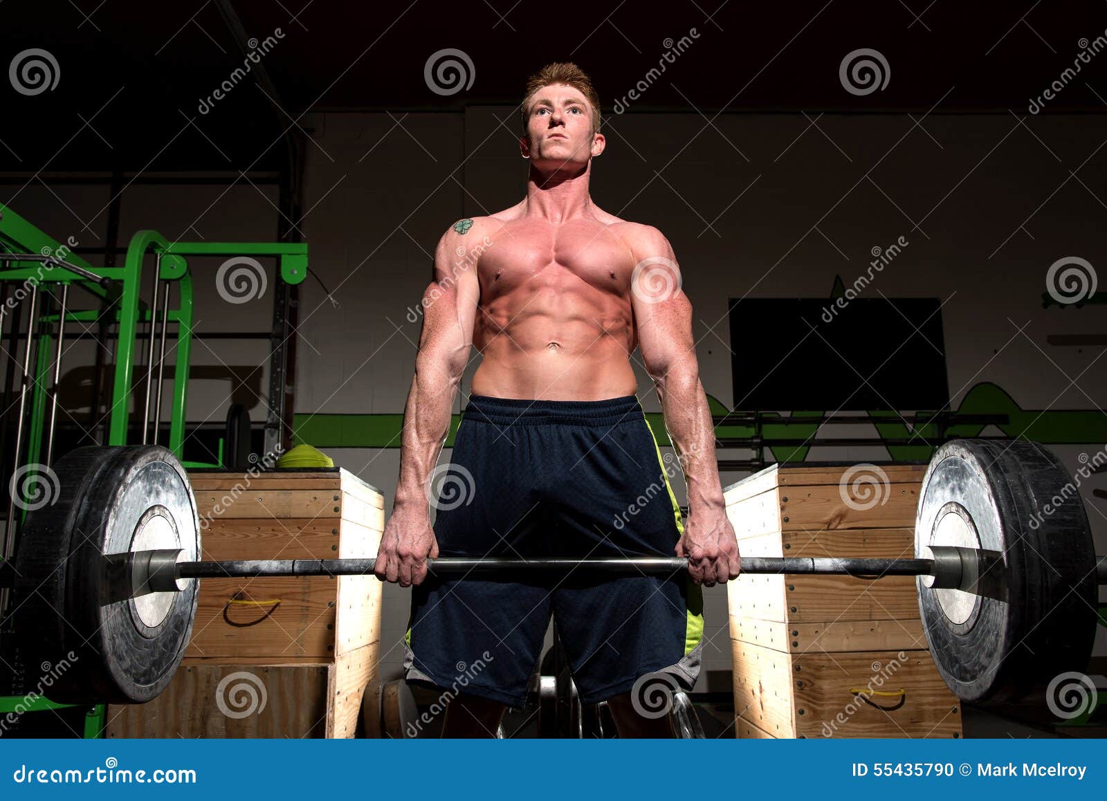 Strong Man Exercising in Dramatic Light Stock Photo - Image of male ...