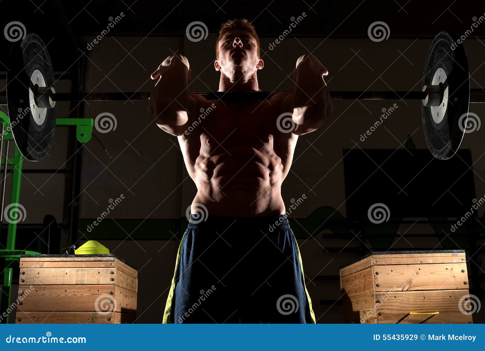 Strong Man Exercising in Dramatic Light Stock Image - Image of personal ...