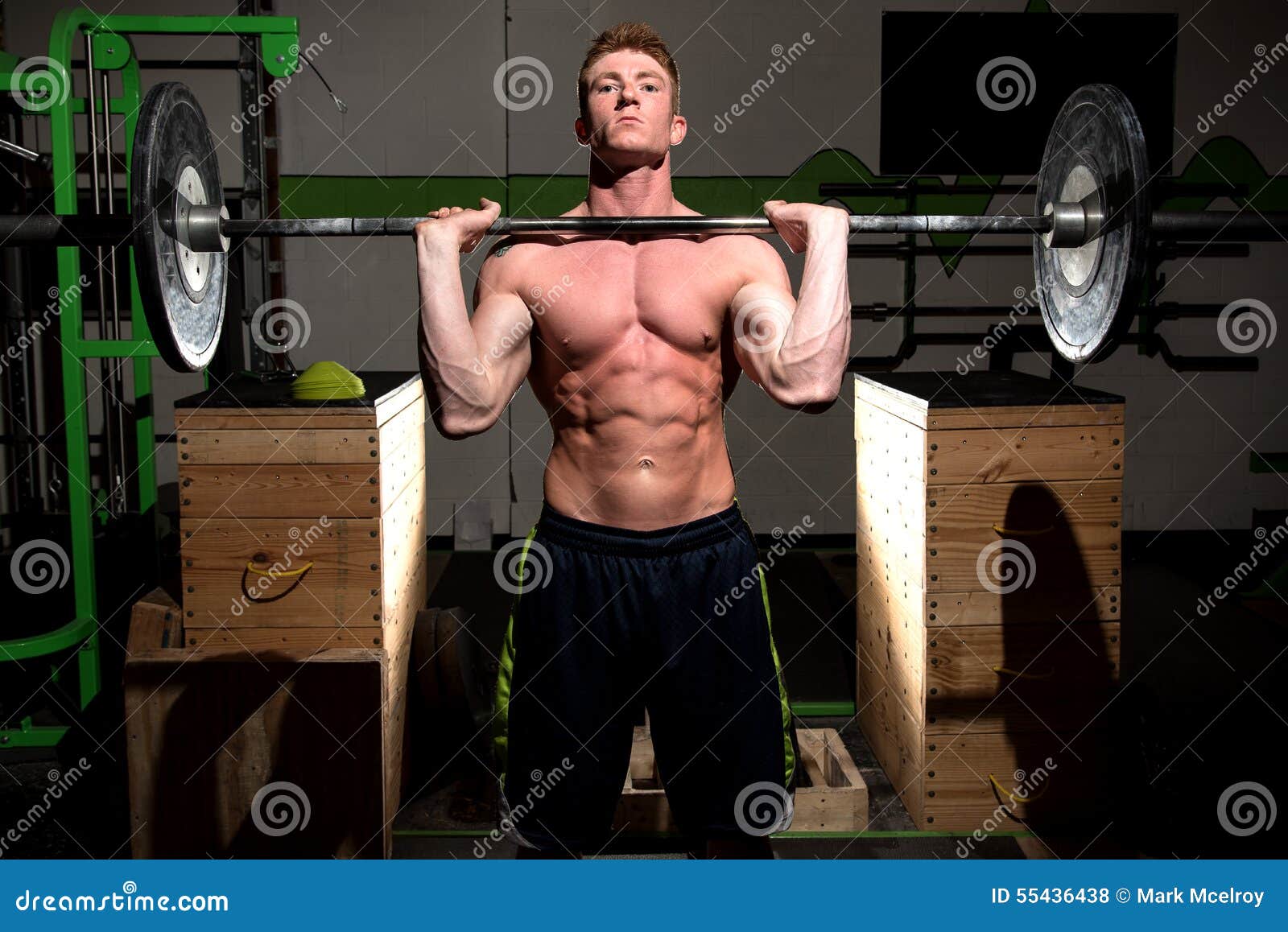 Strong Man Exercising in Dramatic Light Stock Photo - Image of athlete ...