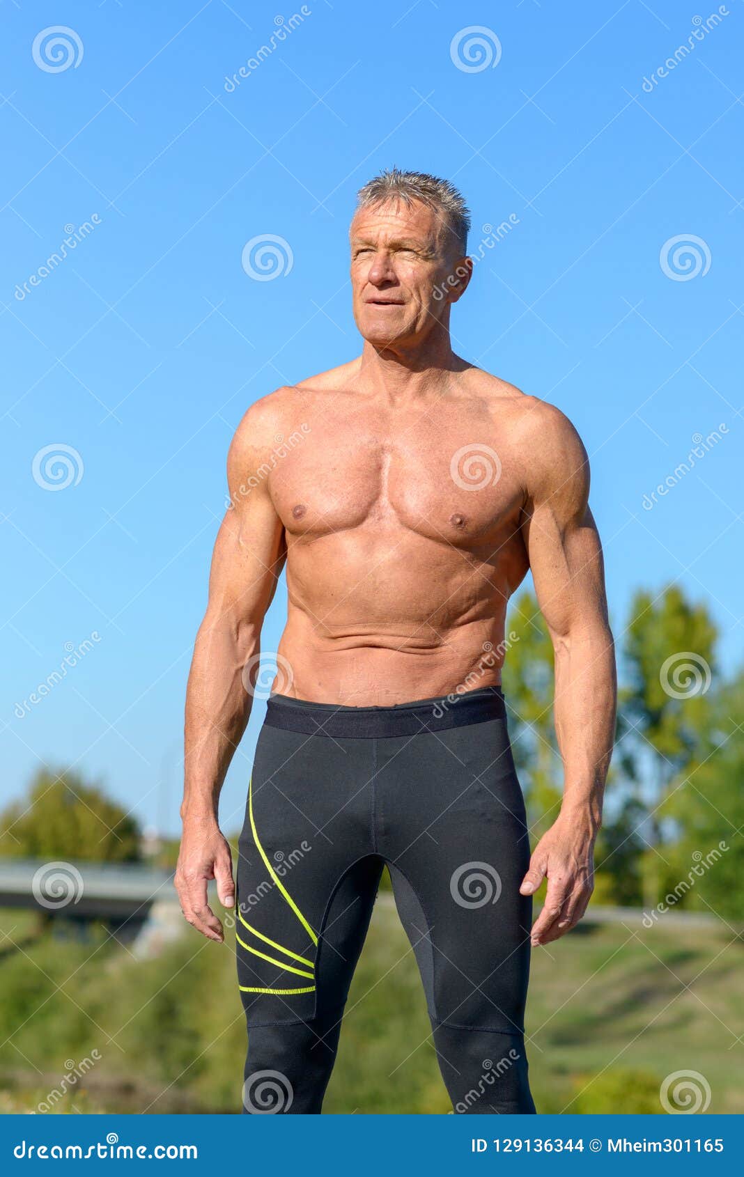 Strong Man Standing in a Green Park Stock Photo - Image of power ...