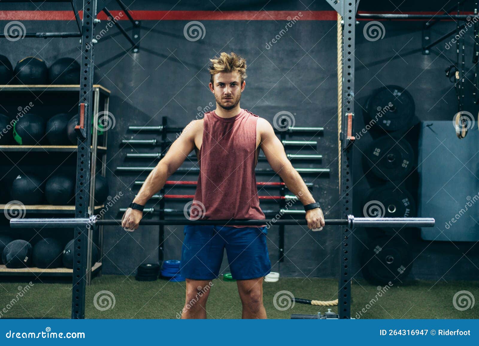 Strong Man Lifting a Barbell in a Gym Stock Image - Image of ...